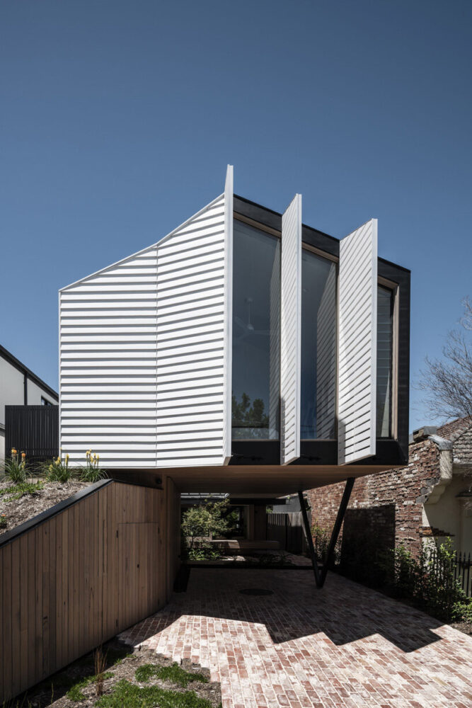 operable façade clads 'pop-up house' by figr architecture studio in ...