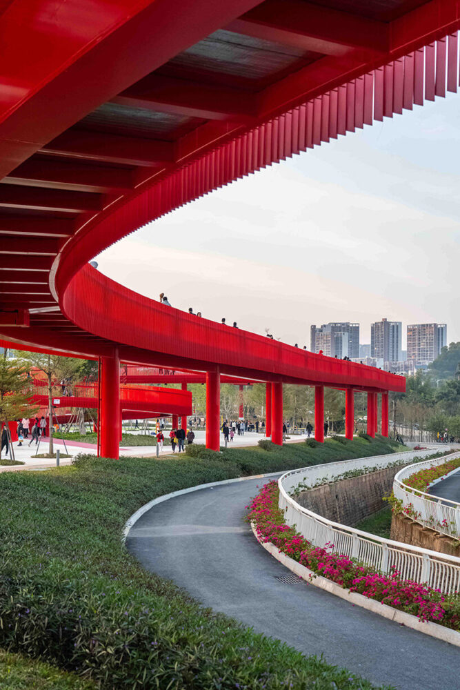an elevated red path connects the 'forest and sports park' in shenzhen