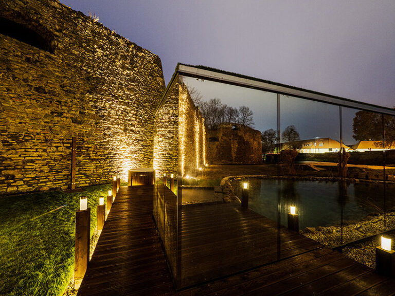 zoltan varro's mirrored spa occupies a 14th century moat in hungary