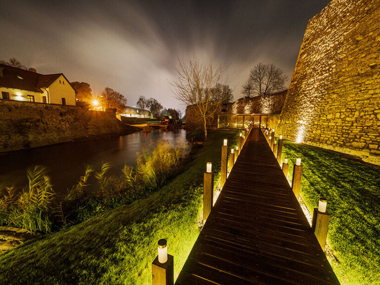 zoltan varro's mirrored spa occupies a 14th century moat in hungary