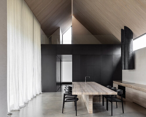 adam kane architects designs asymmetrical timber cabin in rural victoria