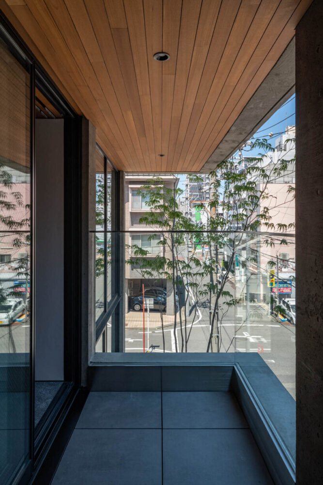 five-story atrium brings natural light into keitaro muto's concrete ...