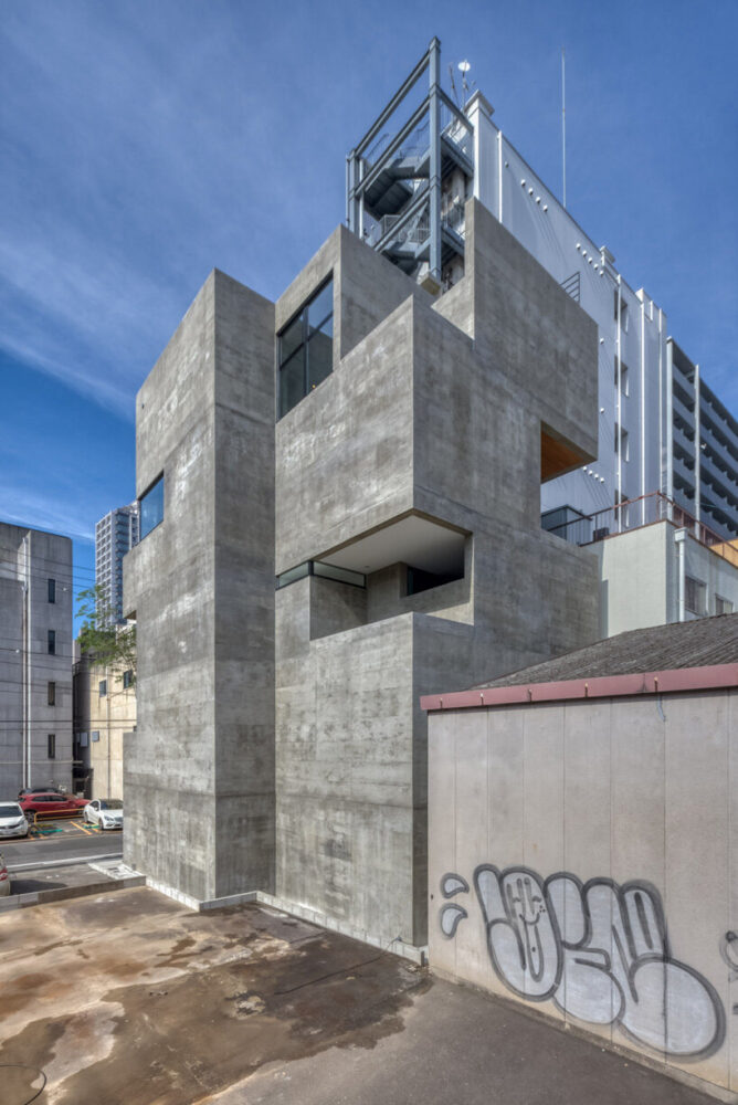 five-story atrium brings natural light into keitaro muto's concrete ...