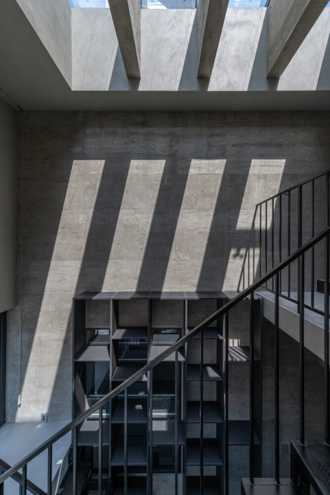five-story atrium brings natural light into keitaro muto's concrete ...