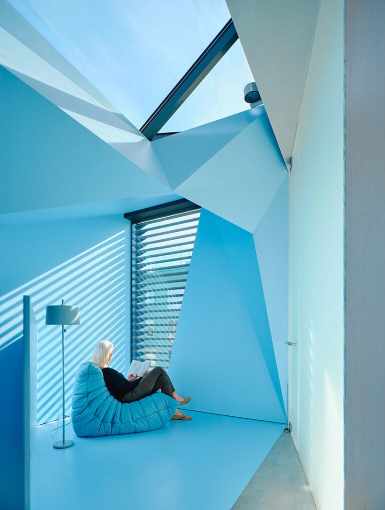 vibrant blue interior peeks through dense facade in san fransisco ...