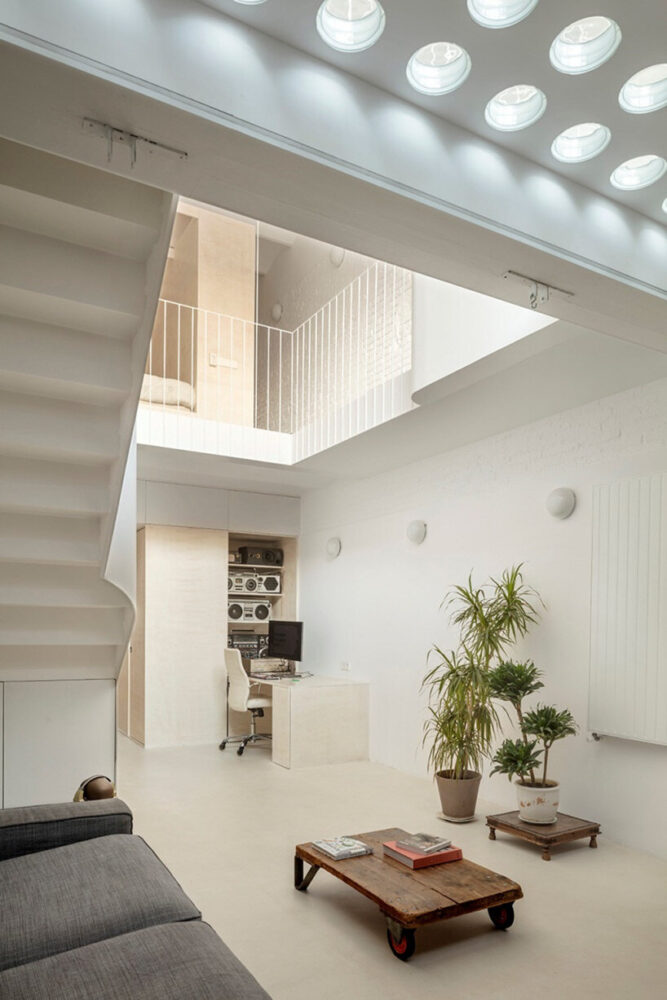 wooden boxes form the interior of this renovated mezzanine apartment by ...