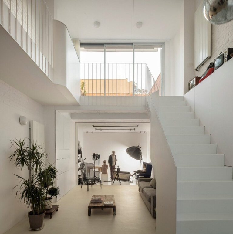 wooden boxes form the interior of this renovated mezzanine apartment by ...