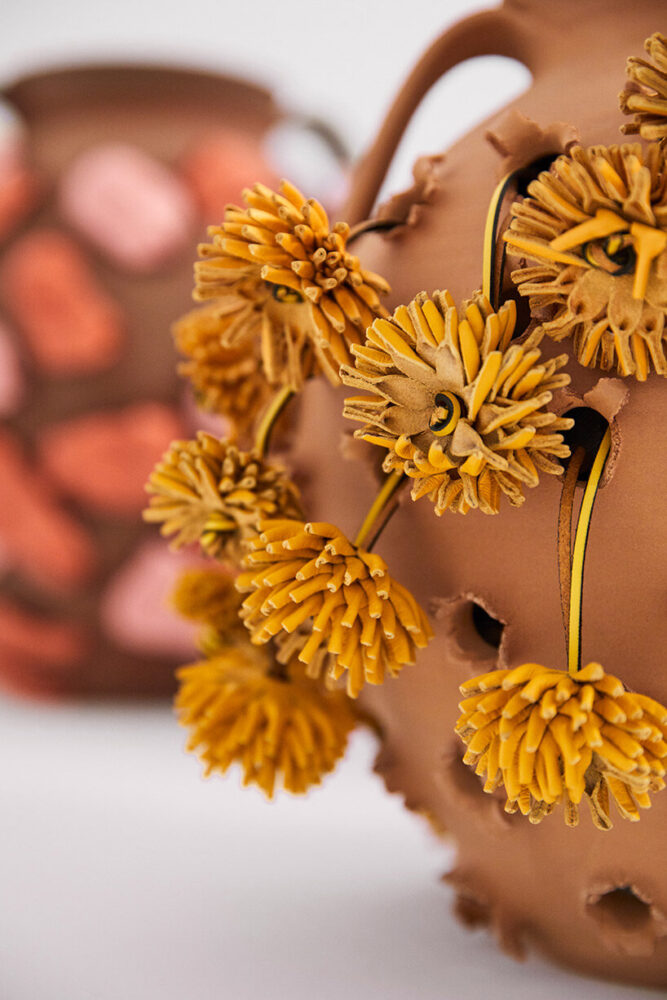 eyes, tongues, flowers + knots emerge from punctured pots in 'LOEWE ...
