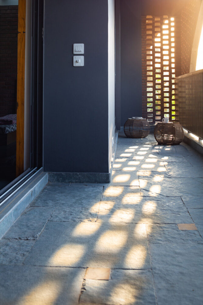circular aperture within brick screen dominates AKDA's house in india