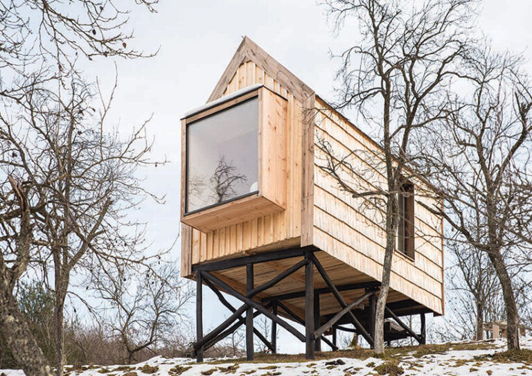 wood + shingle muma hut built by romanian volunteers encourages locals ...