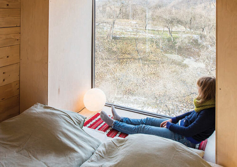 wood + shingle muma hut built by romanian volunteers encourages locals ...