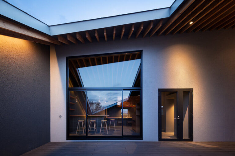 roof cut out reveals secluded terrace in this mixed-use building in japan