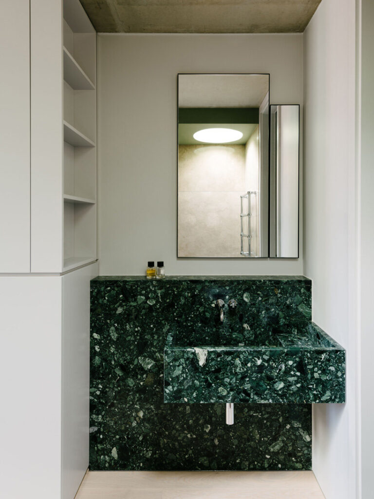 renovated berlin apartment with gold + marble unfolds around green box