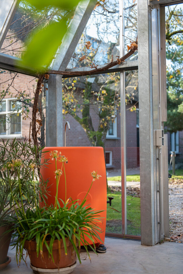 portable water station made of recycled plastic stores rain water