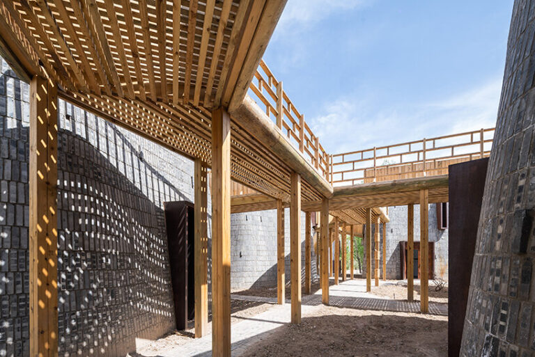 network of floating timber bridge unites nine scattered grottos in ...