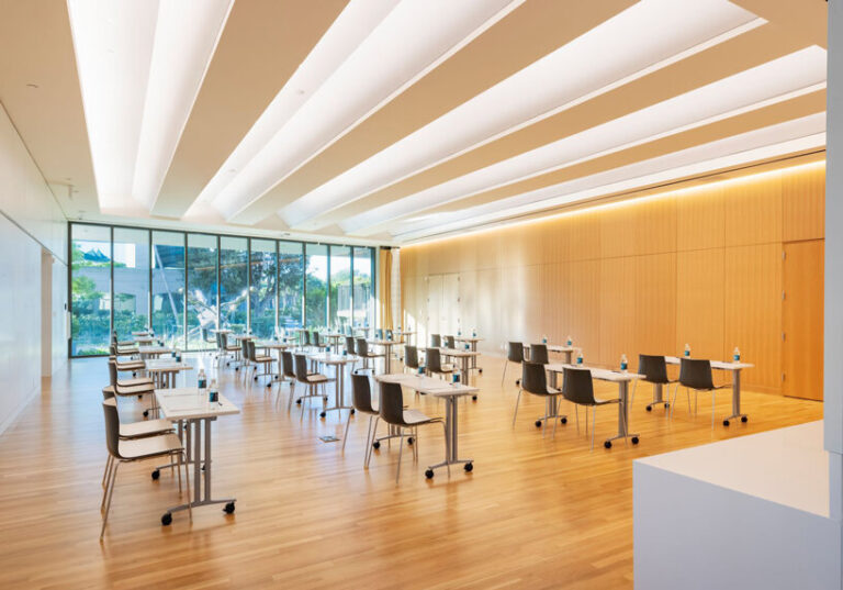 weiss/manfredi restores baker museum in florida with curved stone exterior