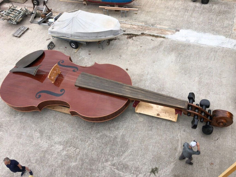 giant violin floats down venice's grand canal complete with string quartet