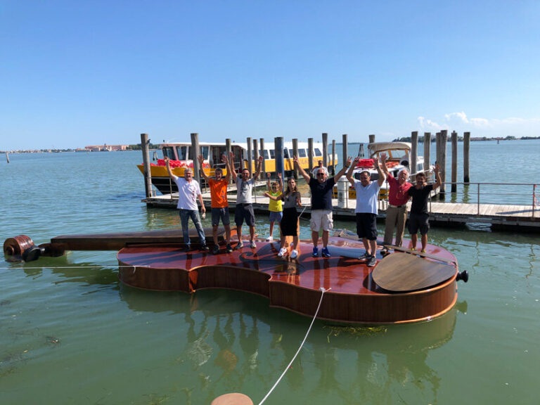 giant violin floats down venice's grand canal complete with string quartet