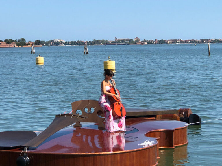giant violin floats down venice's grand canal complete with string quartet