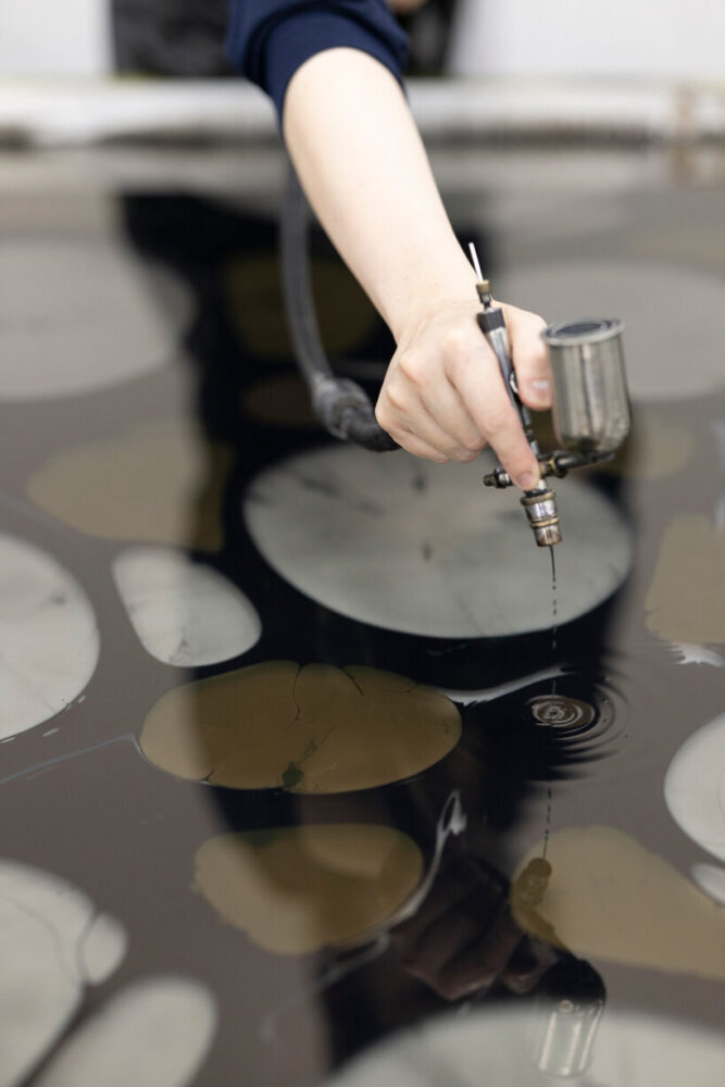 issey miyake exhibits japanese ‘ink marbling’ technique at store in kyoto