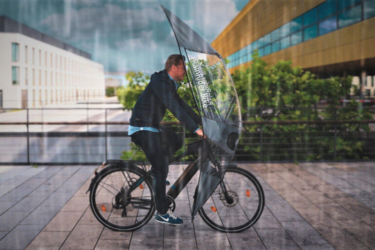 rainrider designs a lightweight cover to protect cyclists from bad weather