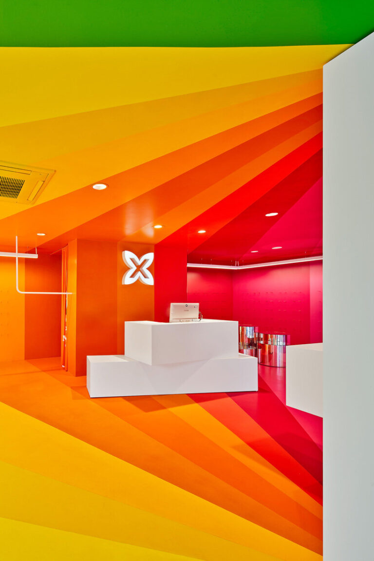 studio animal completes rainbow-hued 'spectrum' store in barcelona