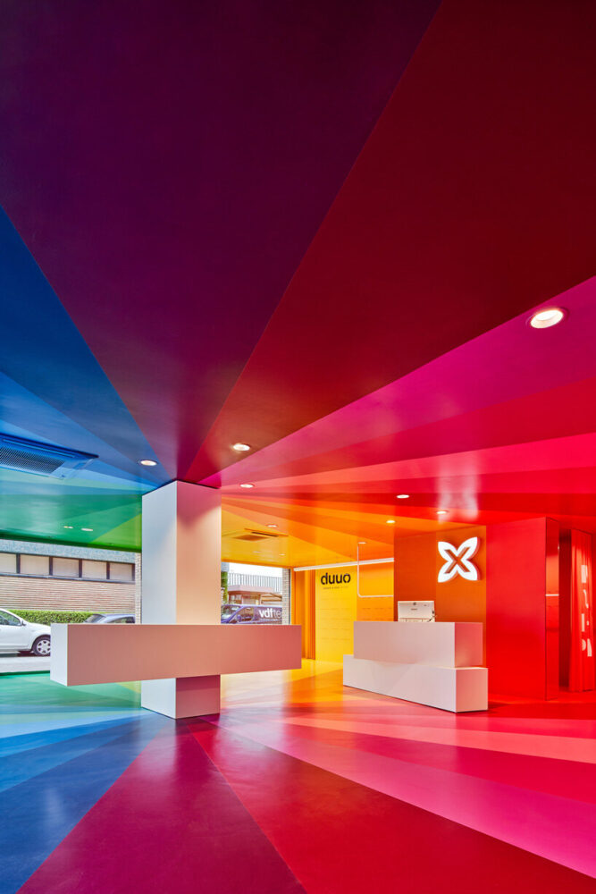 studio animal completes rainbow-hued 'spectrum' store in barcelona