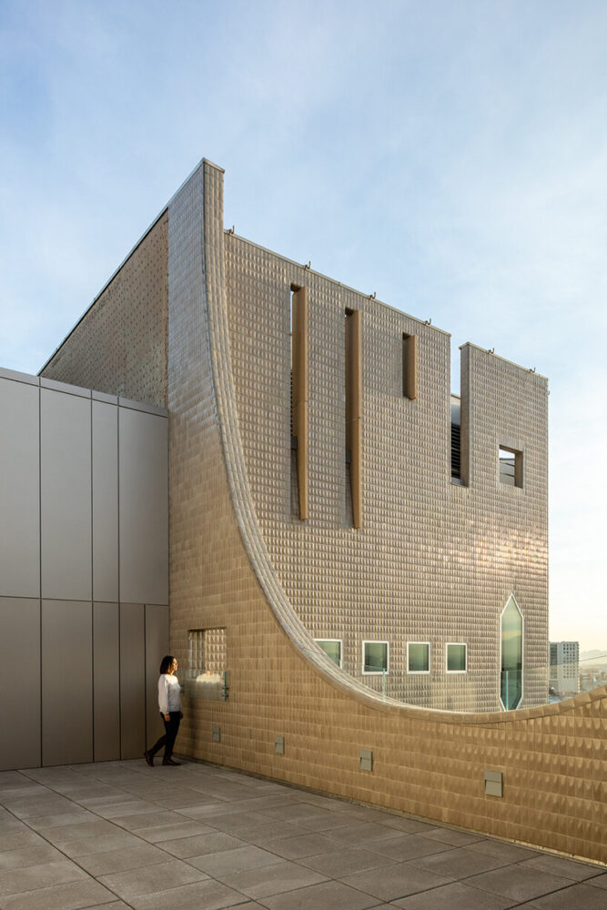 round glazed façade welcomes visitors at denver art museum's transformation