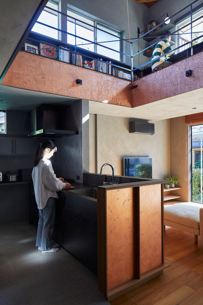 a double height void cuts through this house in japan