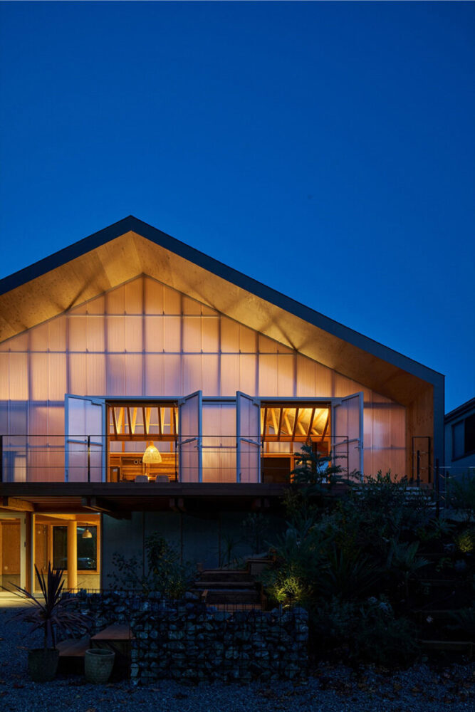 wooden 'tachikawa annex' filters light through its translucent façade