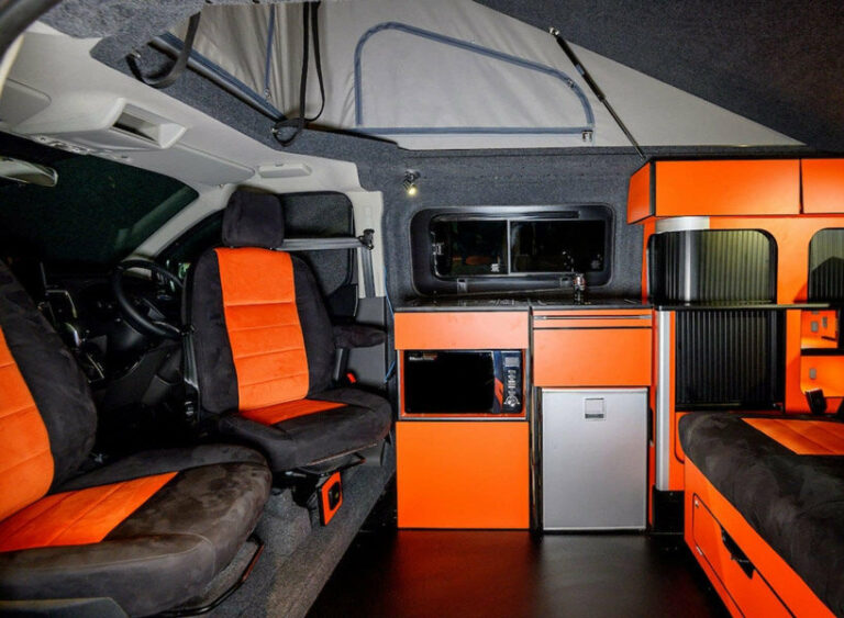 solar panels charge the new spacious ford camper, making it fully electric