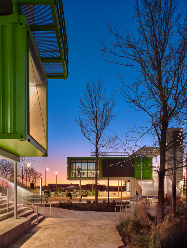 mark odom creates vibrant public space with shipping containers on stilts