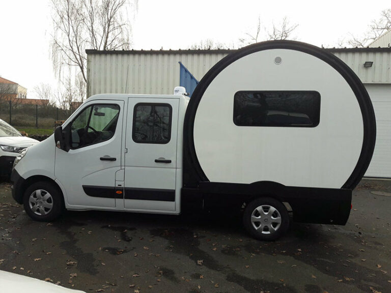 the beauer 3XC camper is a tiny can-shaped trailer that expands to ...