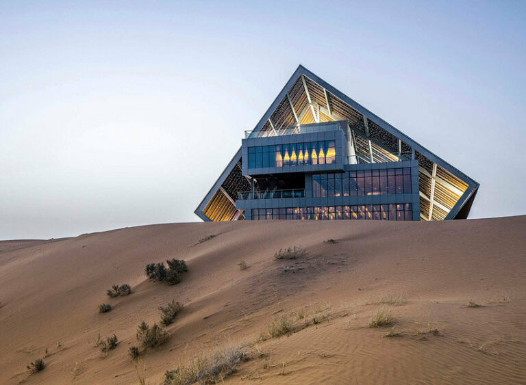 treasure chest-inspired ‘desert galaxy camp’ is half-buried in the sand ...