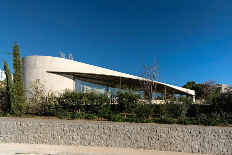 tense architecture network adds circular pool to concrete island ...