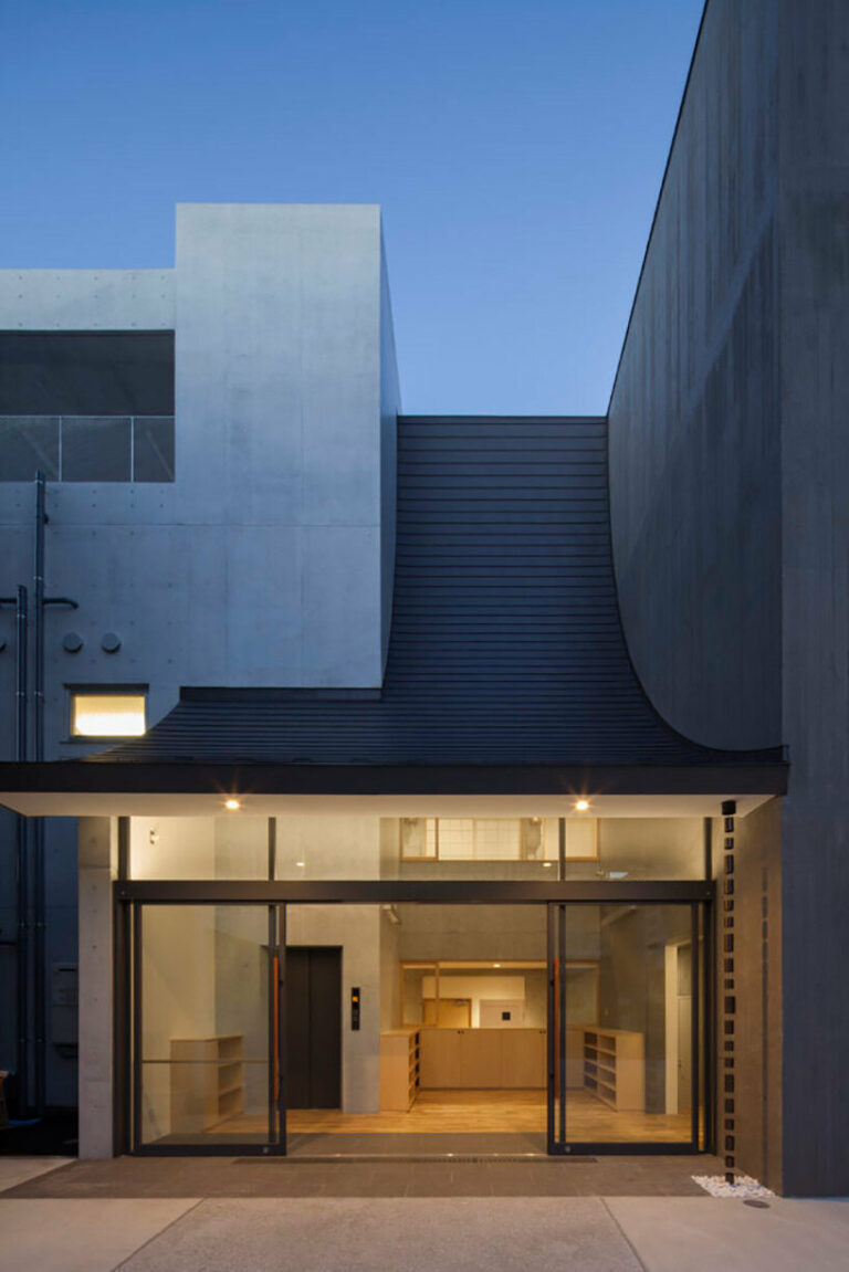 curved roof welcomes visitors into abanba's reconstructed tokyo temple