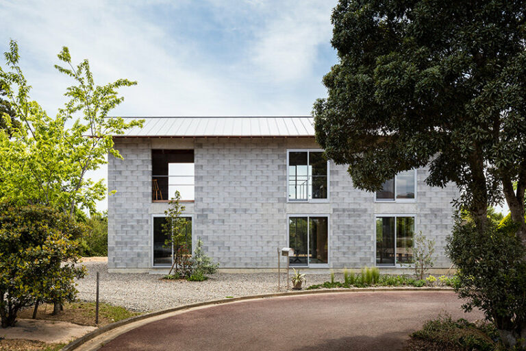 KKAA TYAA tops concrete 'house of joy' with warm timber roof
