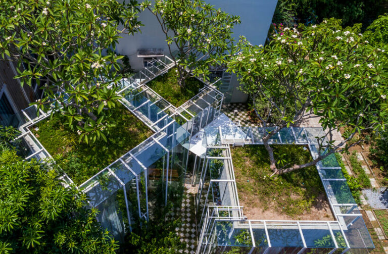 nguyen khai's labri house is a cluster of glass boxes overgrown by nature