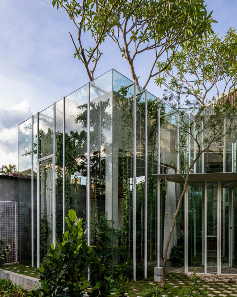 nguyen khai's labri house is a cluster of glass boxes overgrown by nature