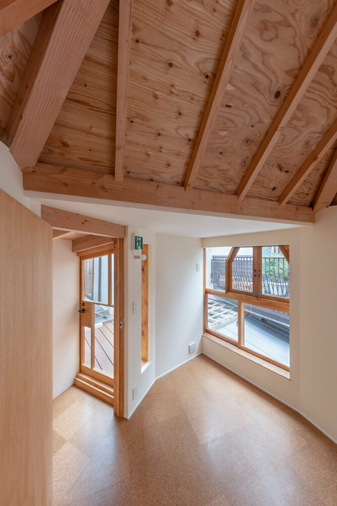 maki yoshimura builds nursery extension between two retaining walls in ...