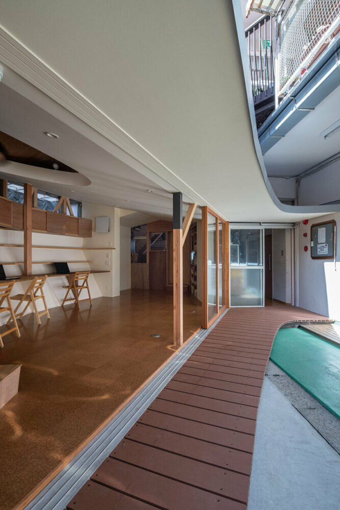 maki yoshimura builds nursery extension between two retaining walls in ...