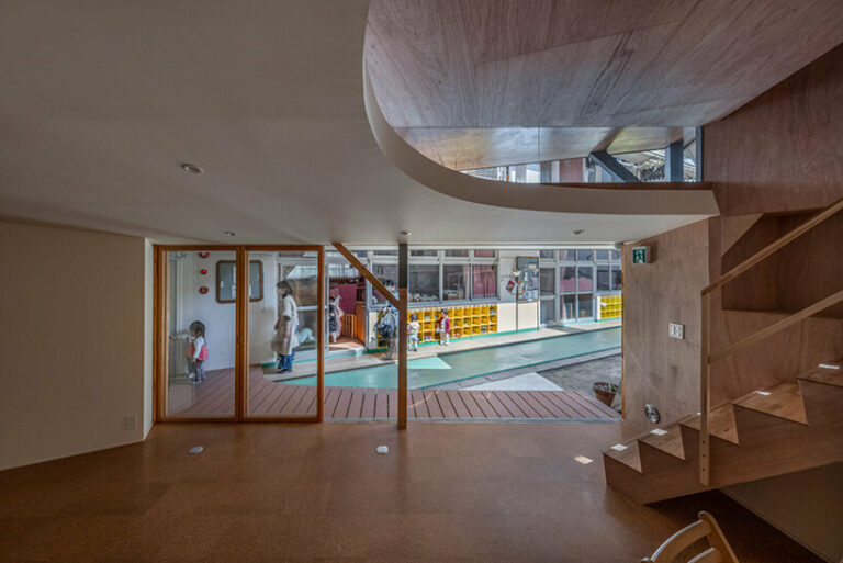 maki yoshimura builds nursery extension between two retaining walls in ...