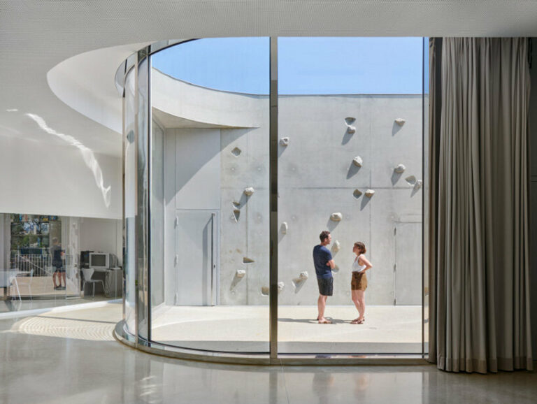 animu media library's concrete curves embrace the site's existing ...