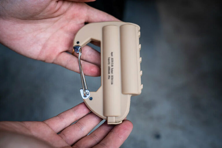 portable power bank clips on belt loops, bikes, and bags like a carabiner