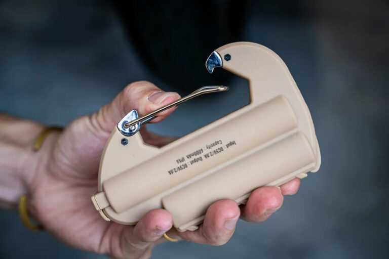 portable power bank clips on belt loops, bikes, and bags like a carabiner