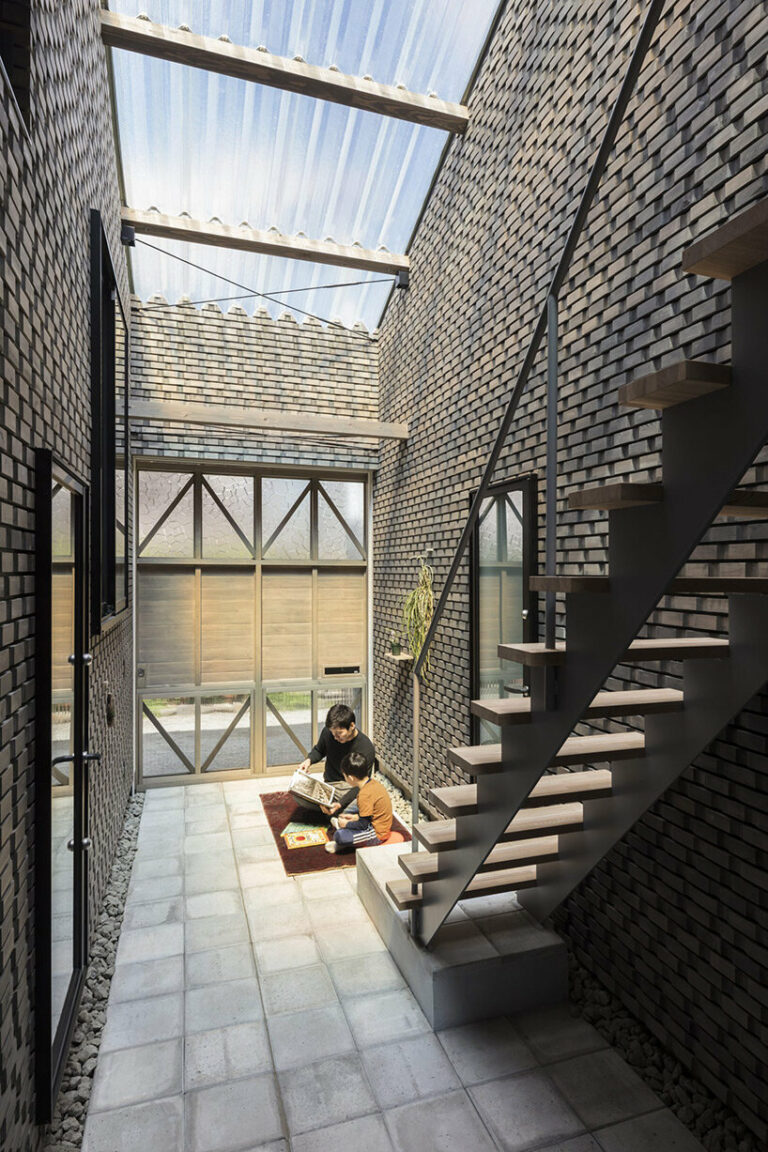 sato+ lodges semi-open house with transparent roof into narrow alley in ...