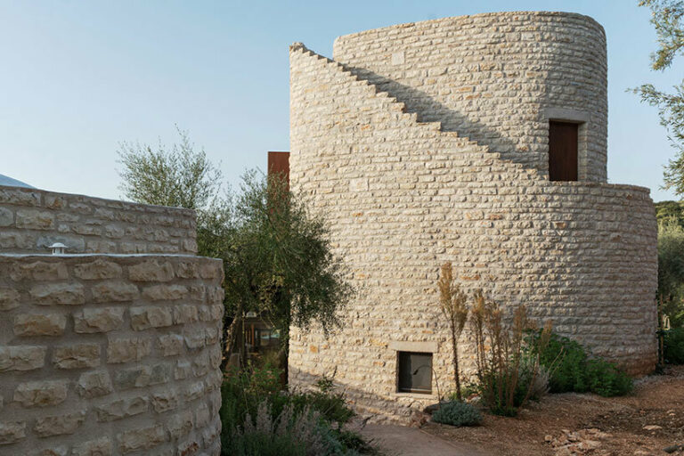 hiboux architecture nestles cluster of scattered curved volumes in ...