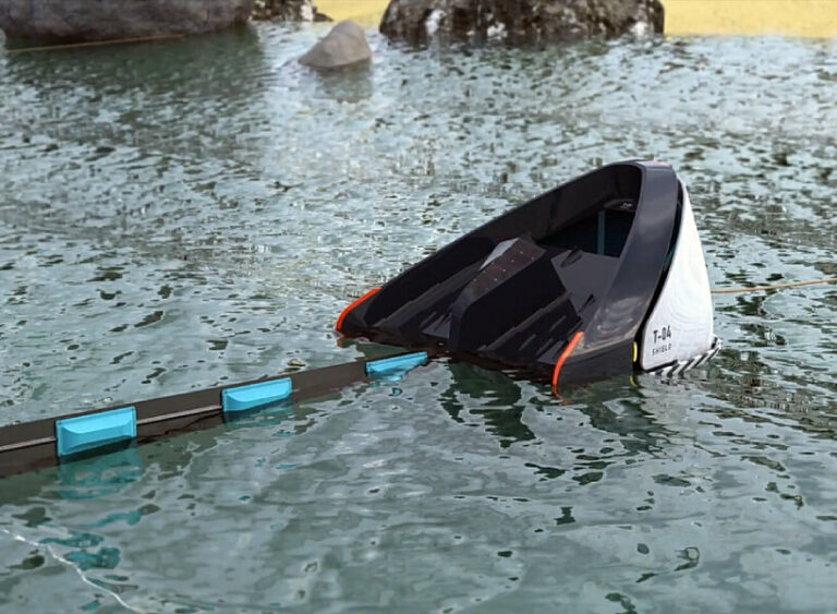 garbage collector by student scoops ocean trash with waves