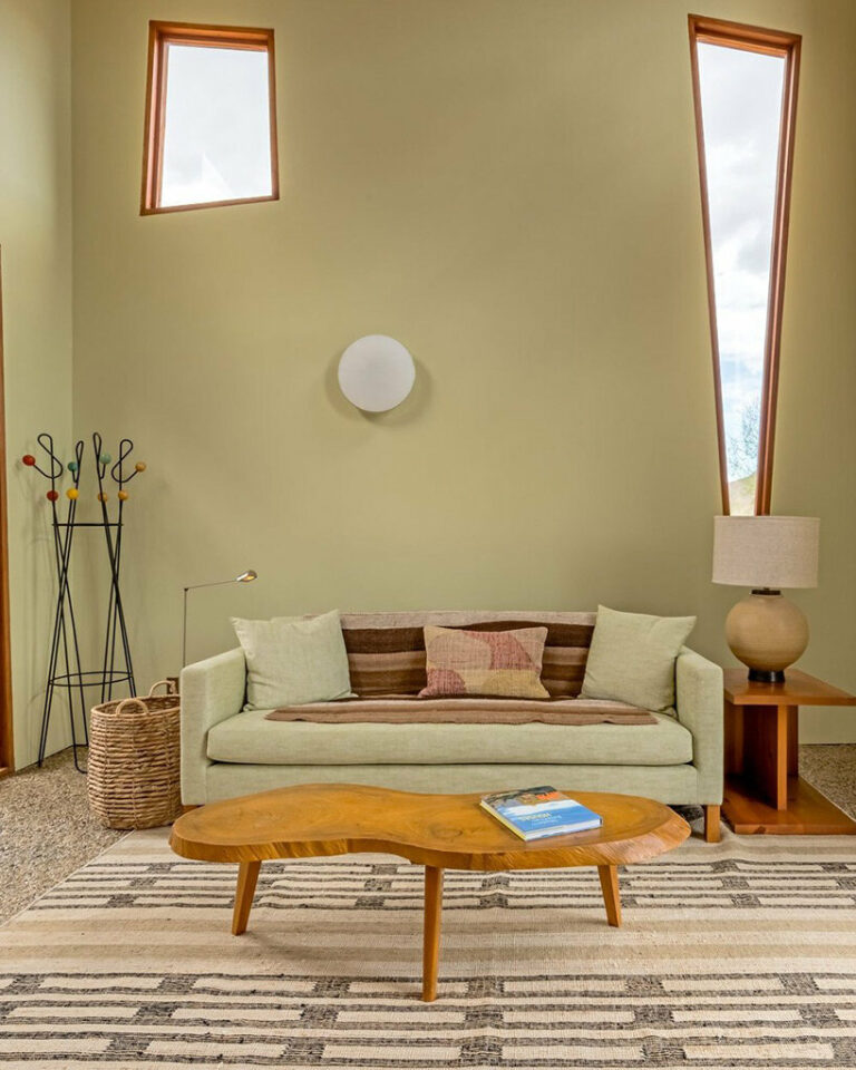 emerging from the rugged joshua tree desert, colorful 'monument house ...