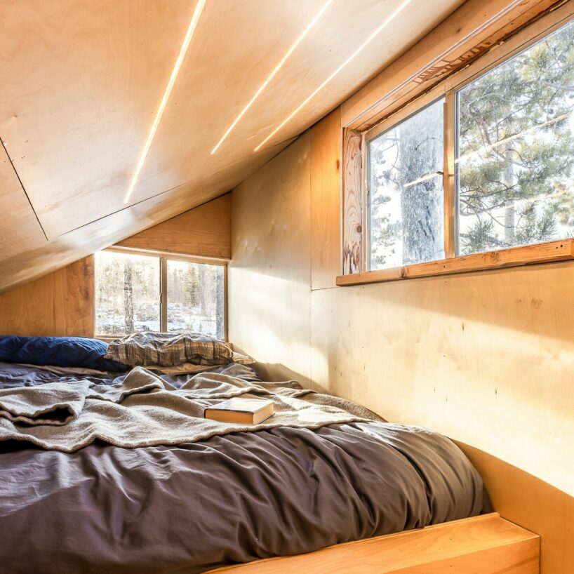 michael quirk completes tiny net-zero cabin in colorado forest